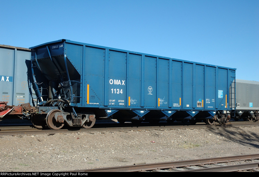 OMAX 1134 hopper, damaged in a collision of runaway UP 9366 and MP 7509 caboose in the yard